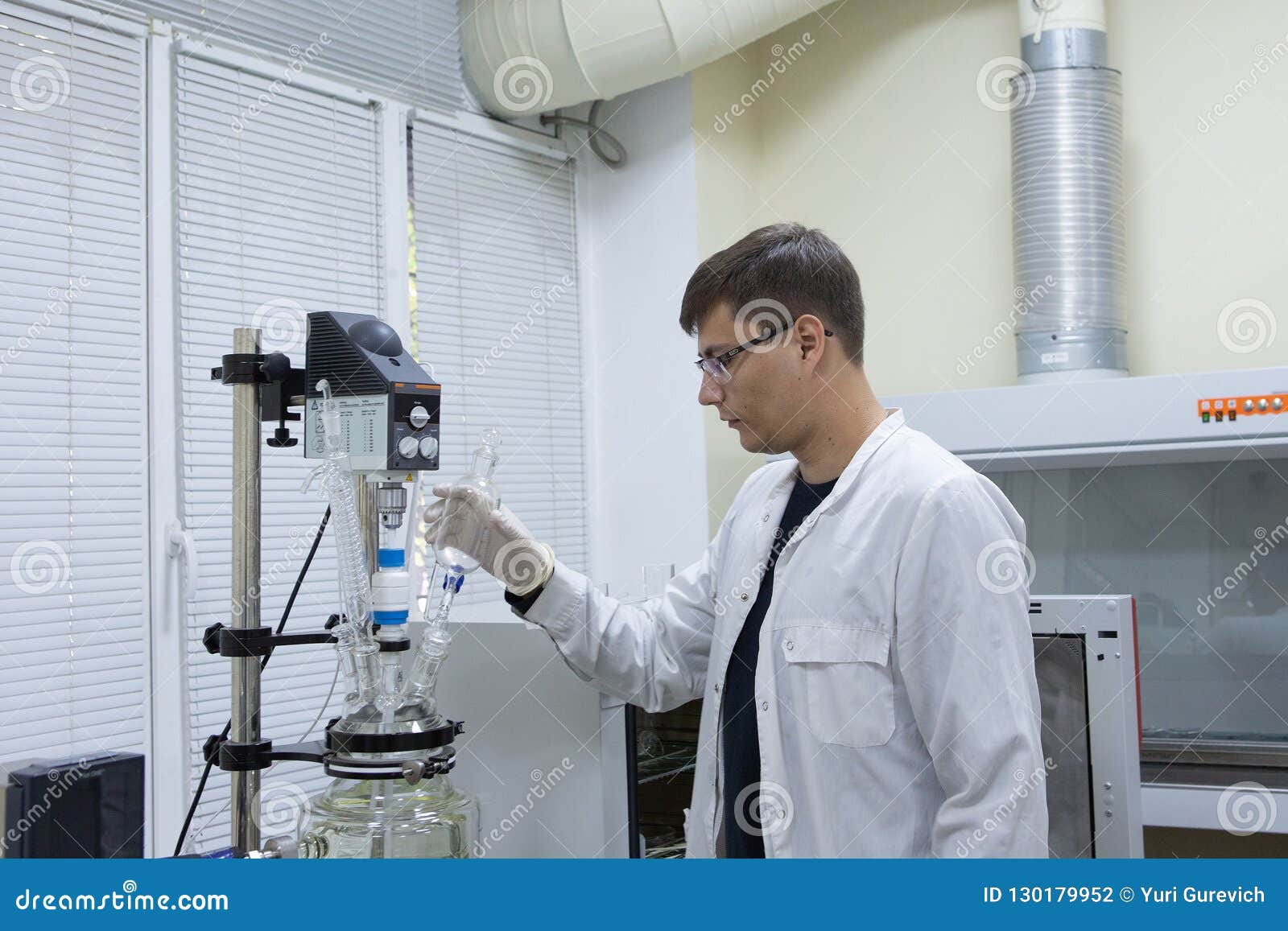 Serious Clinician Studying Chemical Element in Working Environment ...