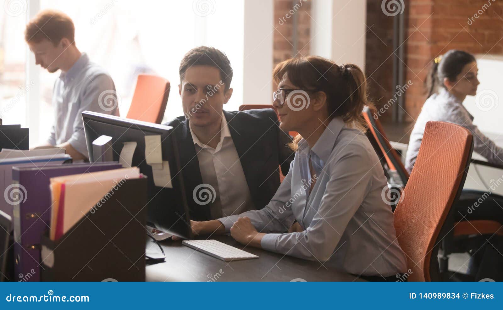 Serious Colleagues Working Together in Modern Office Talking Using ...