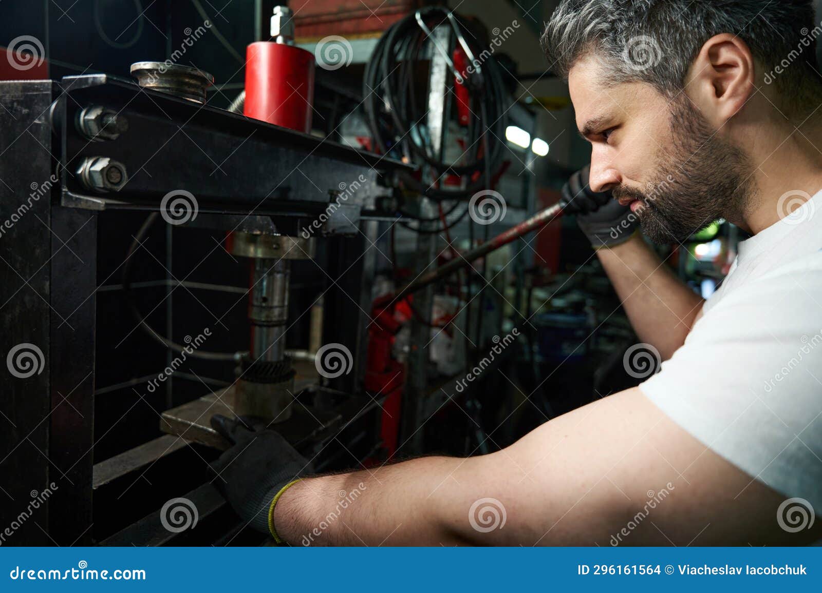 Qualified Mechanic is Using Machine for Repairing Car Components Stock ...