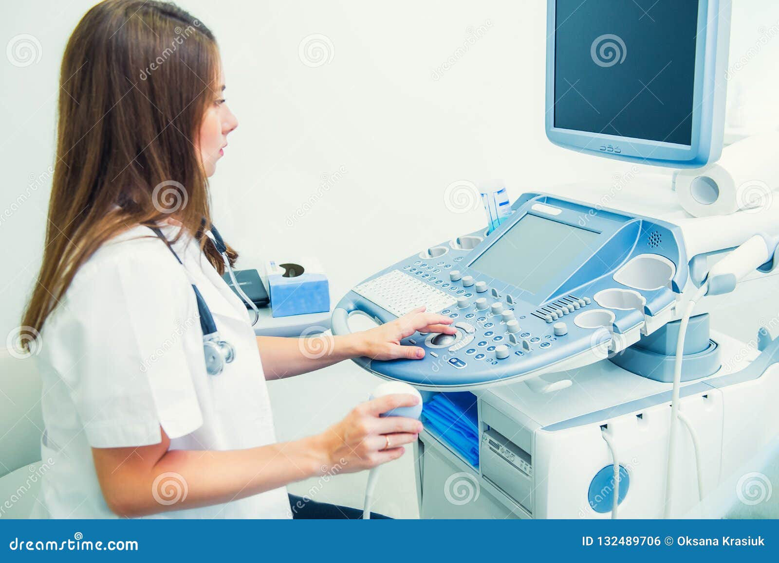 Serious, Concentrated Young Doctor, Specialist Using Ultrasound ...