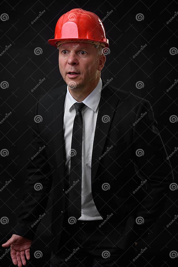 Serious Construction Worker in Red Helmet Stock Photo - Image of ...