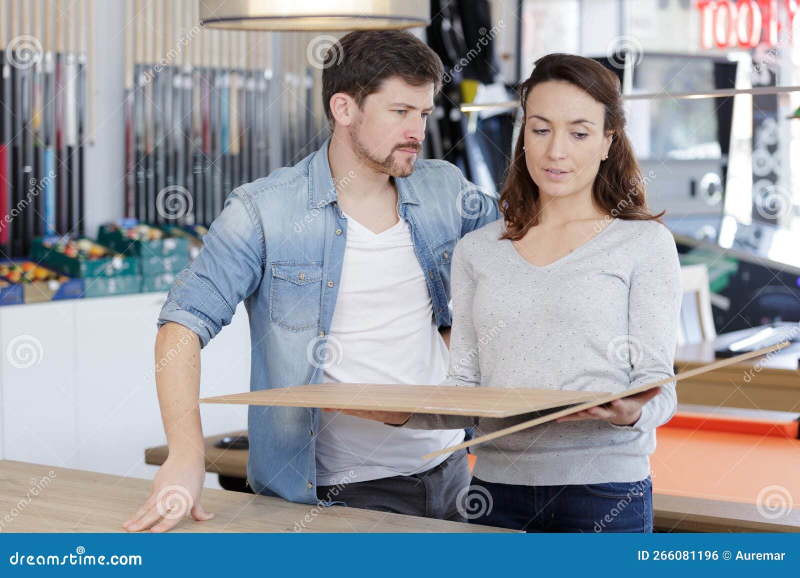 Serious Couple Making Decision on Wood Finish Stock Photo - Image of ...