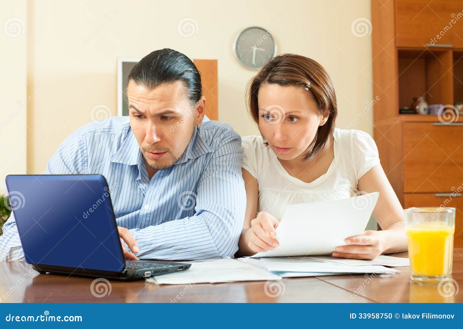Serious Couple Reading Document Stock Photo - Image of information ...