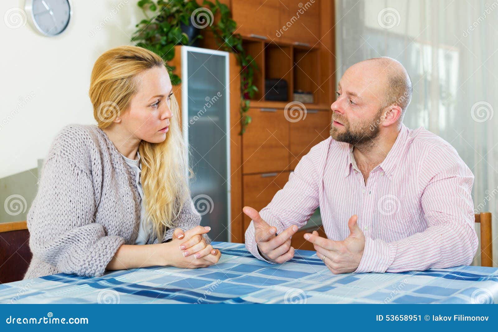 Serious Couple Talking in Home Stock Image - Image of husband, quiet ...