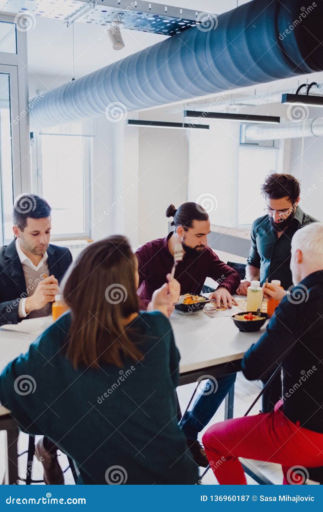 Serious Coworkers Eating at the Table in the Office Stock Image - Image ...