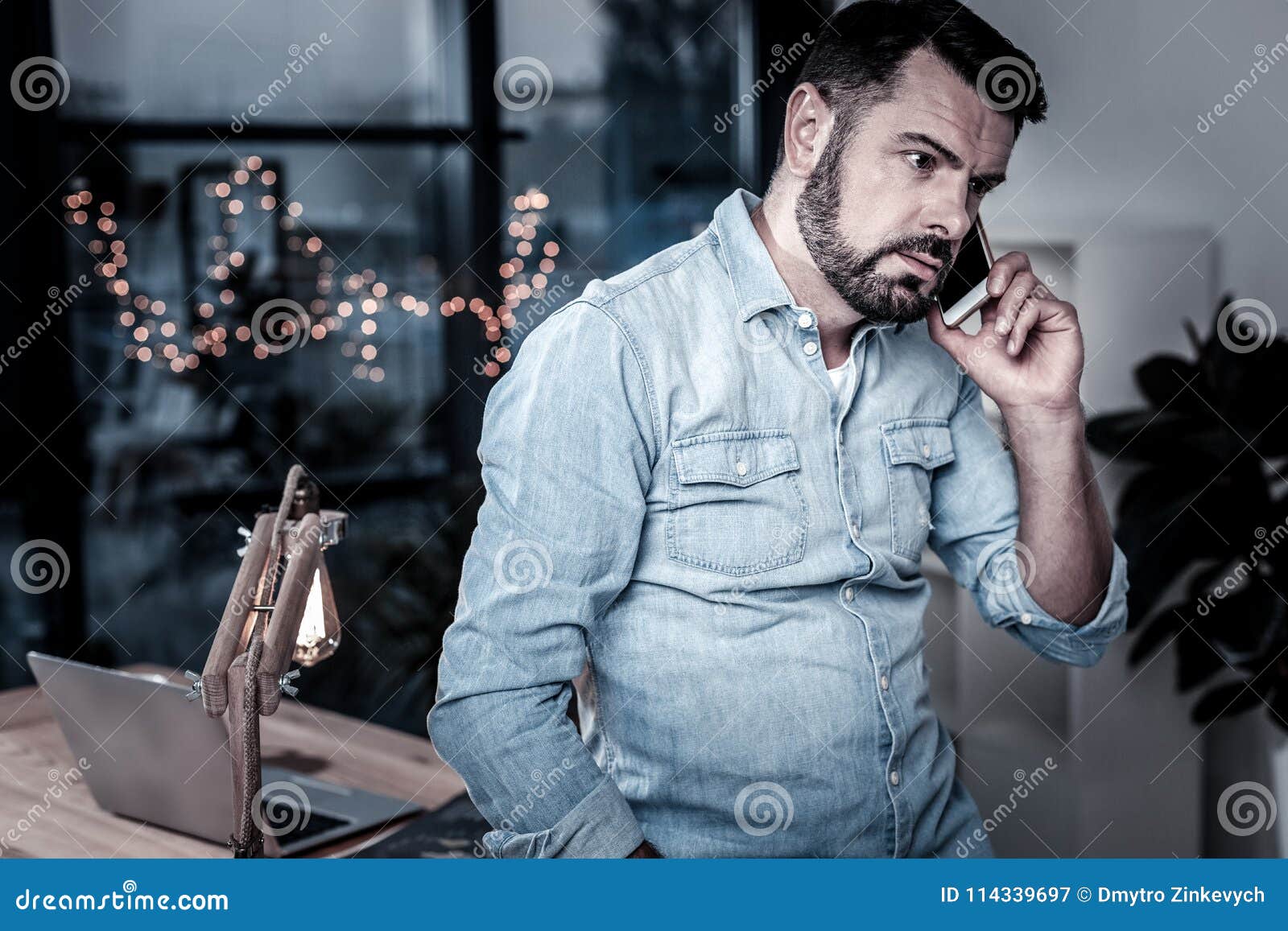 Serious Deep Man Standing and Having Phone Conversation. Stock Image ...