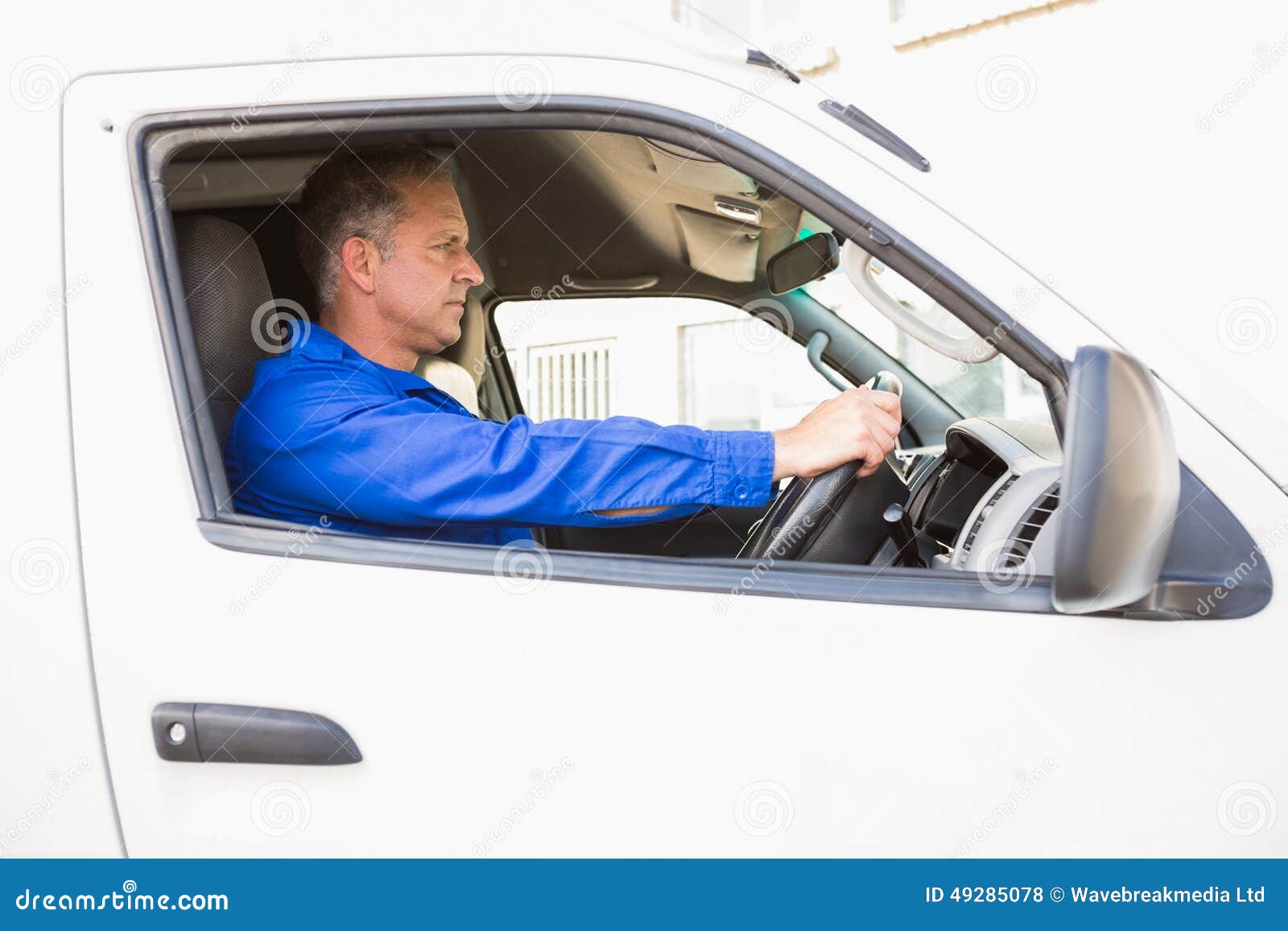 Serious Delivery Man Driving His Van Stock Photo - Image of courier ...