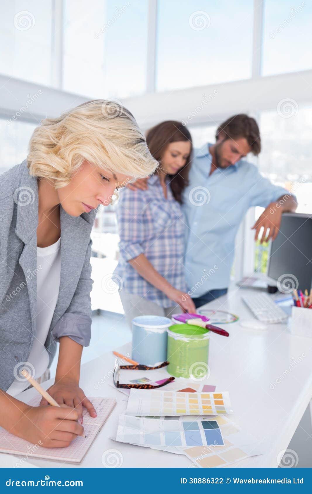 Serious Designer with a Lovely Couple Stock Photo - Image of design ...