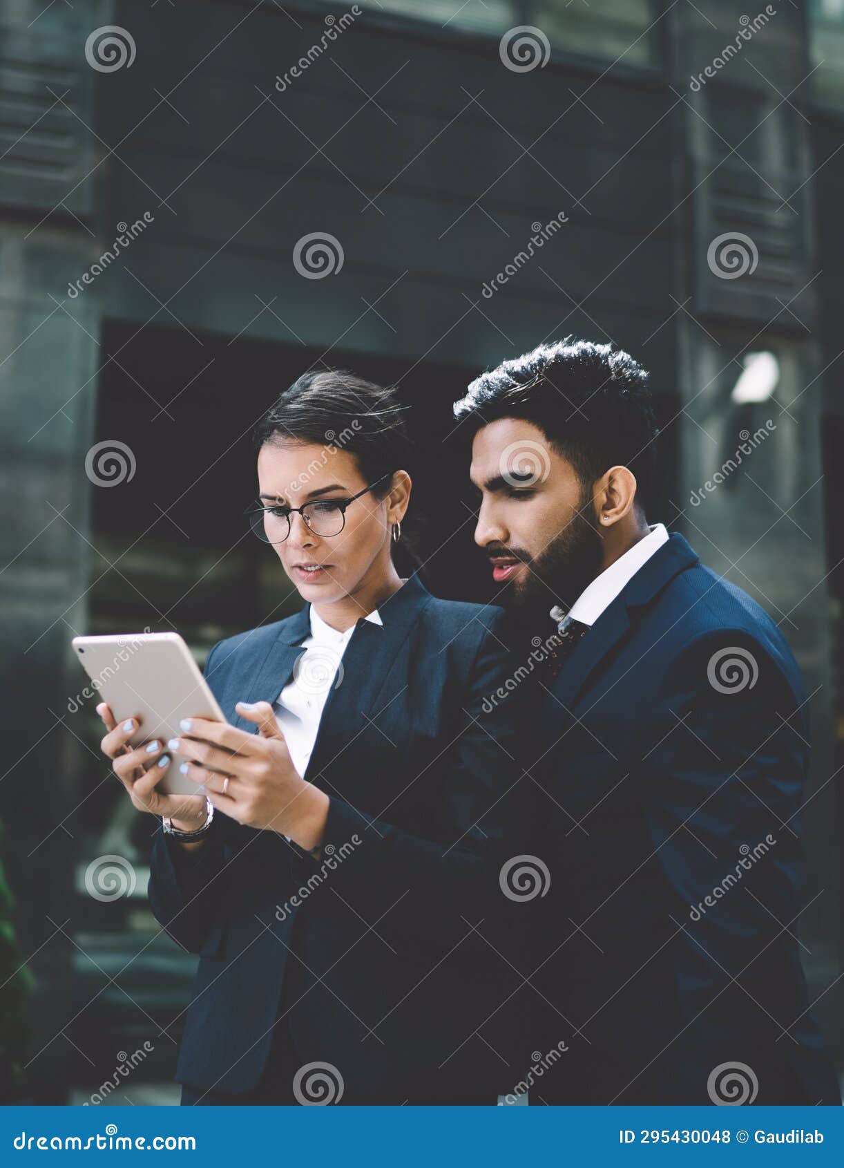 Serious Diverse Man and Woman Watching Online Video with Useful ...