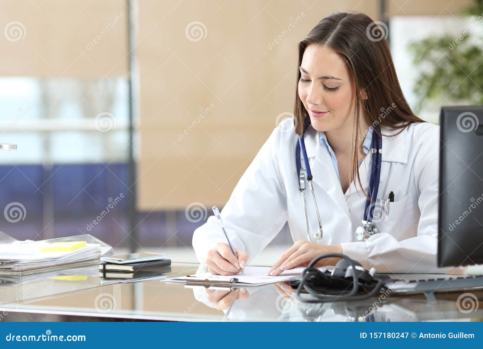 Serious Doctor Writing at Consultation Stock Image - Image of desk ...