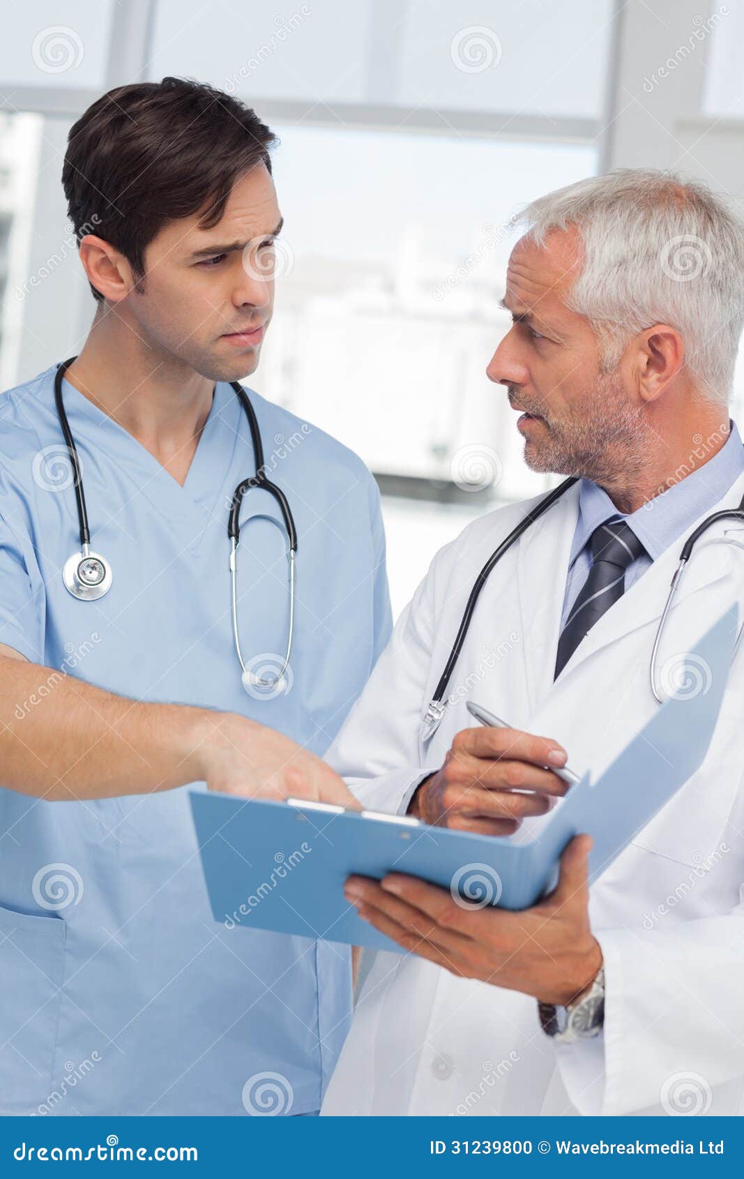 Serious Doctors Talking about File Stock Photo - Image of healthcare ...