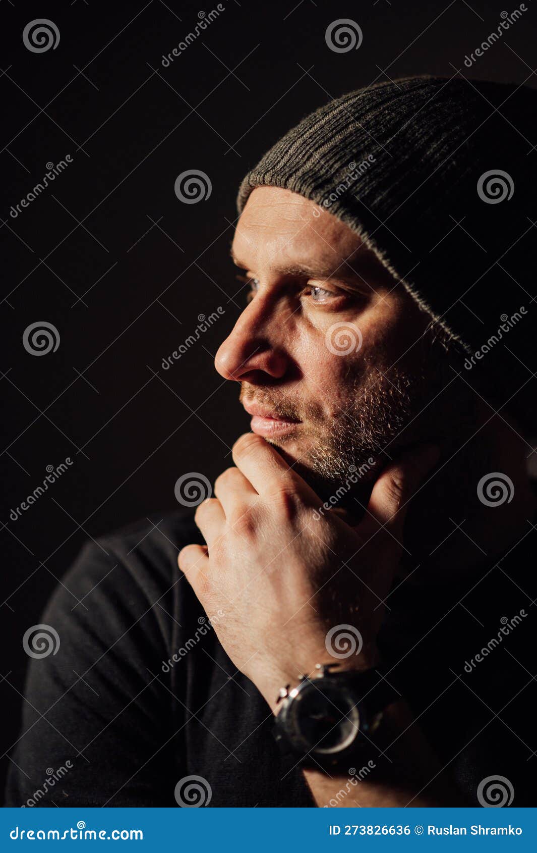 Serious Dramatic Man Looking Away while Standing Against Black Studio ...