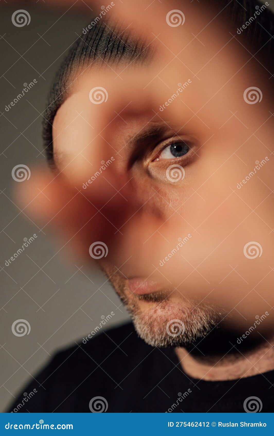 Serious Dramatic Man Looking Away while Standing Against Black Studio ...