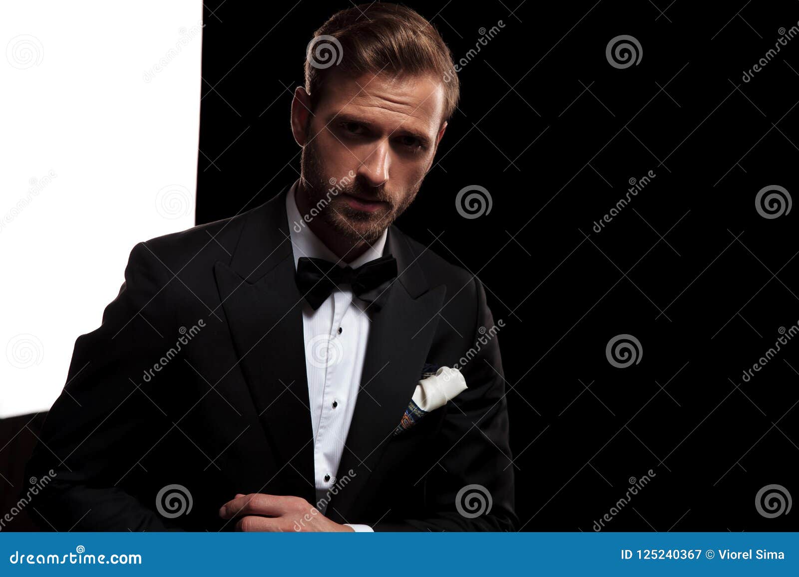 Serious Elegant Man in Tuxedo Fixing His Cufflinks Stock Image - Image ...