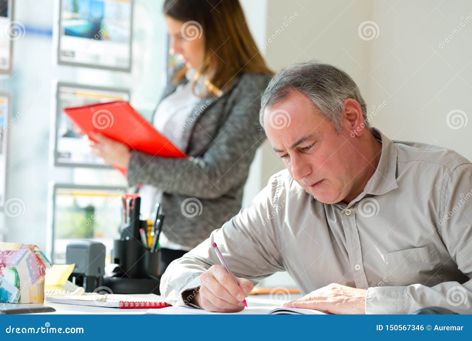 Serious Employee Reviewing Documents Stock Photo - Image of casual ...