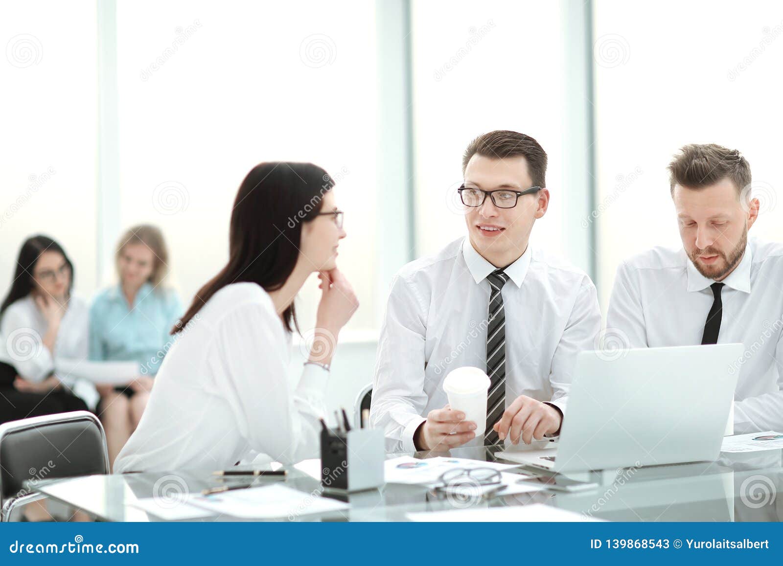 Serious Employees Sitting at the Office Desk Stock Image - Image of ...