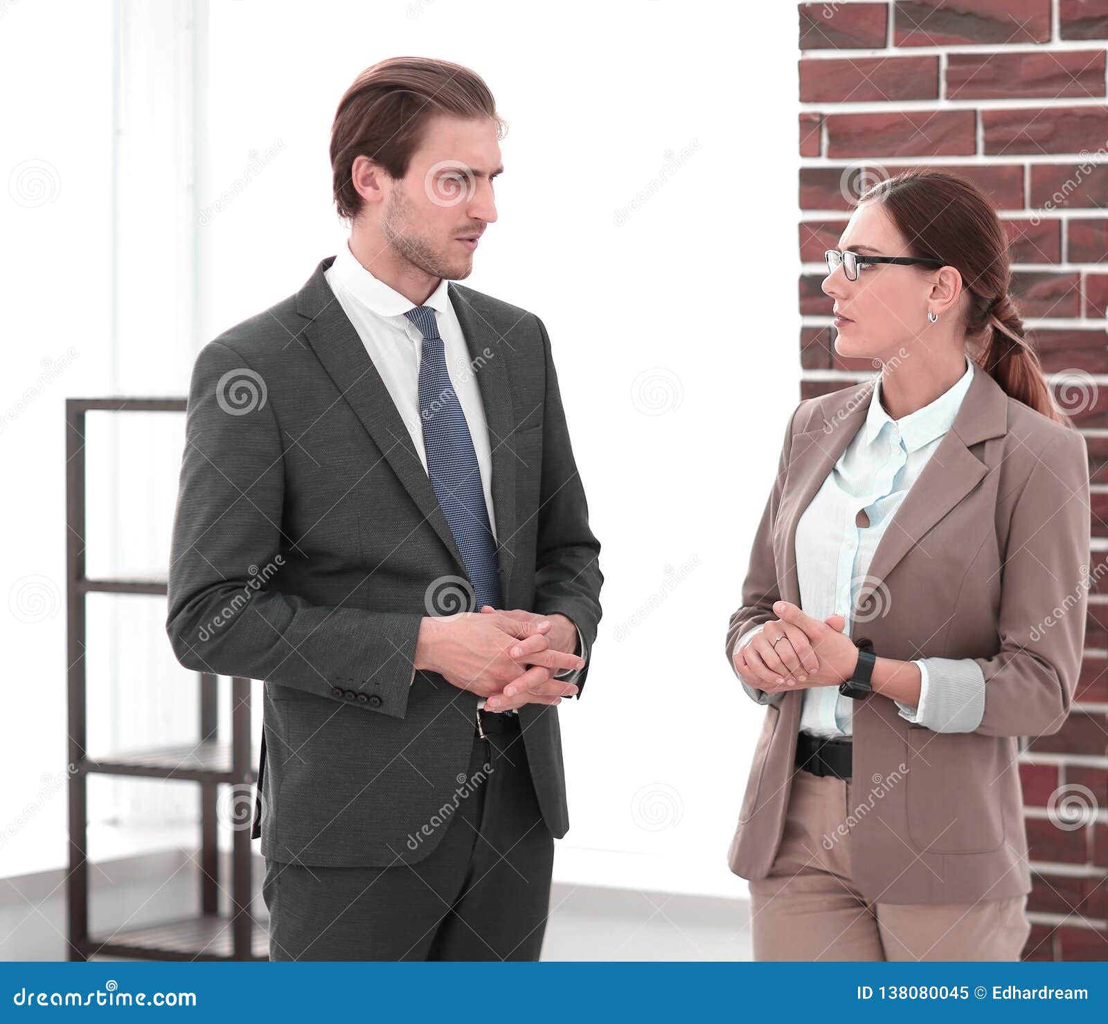 Serious Employees Talk Standing in the Office Stock Image - Image of ...