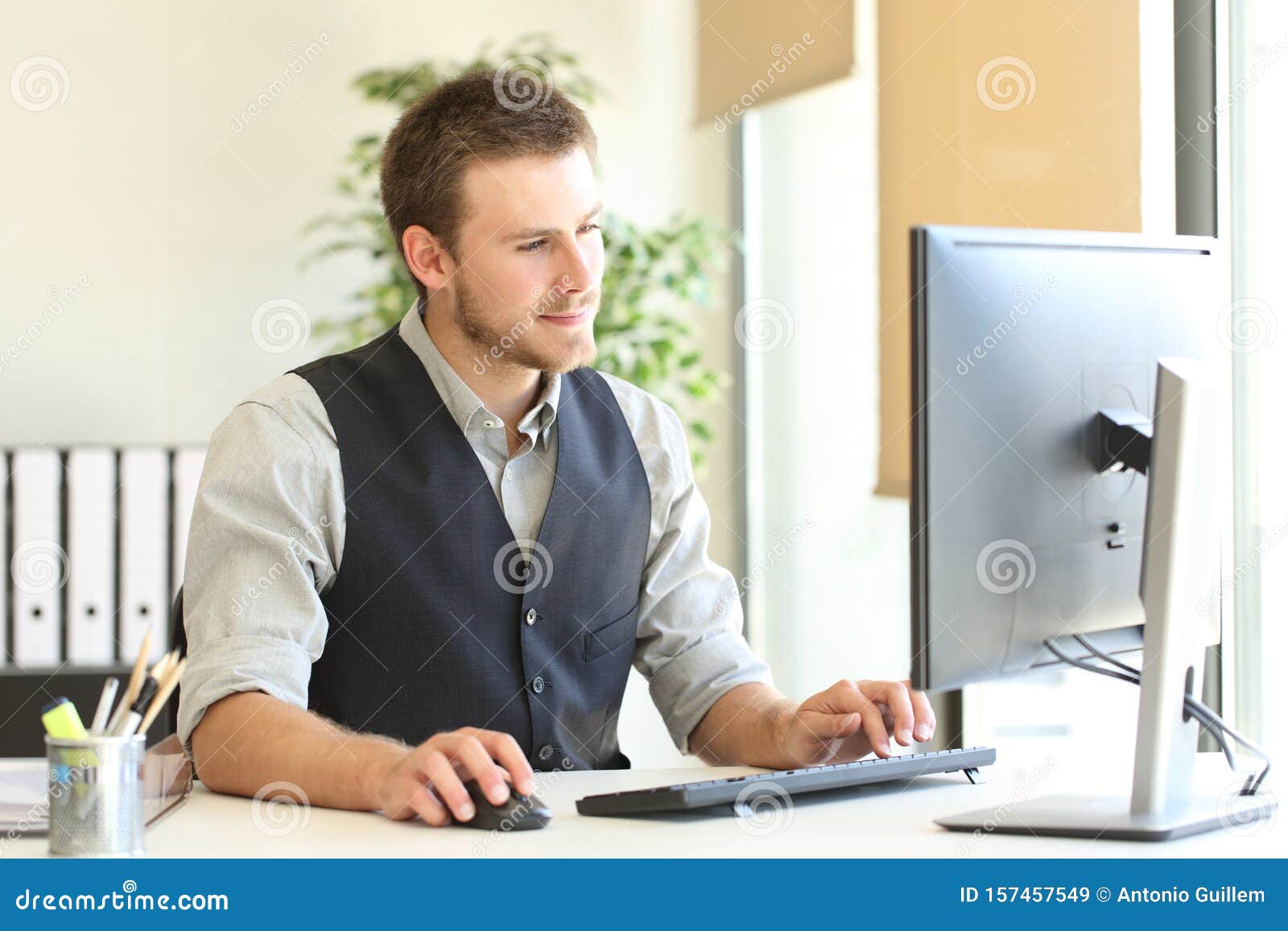Serious Executive Browsing Computer Content at Office Stock Image ...