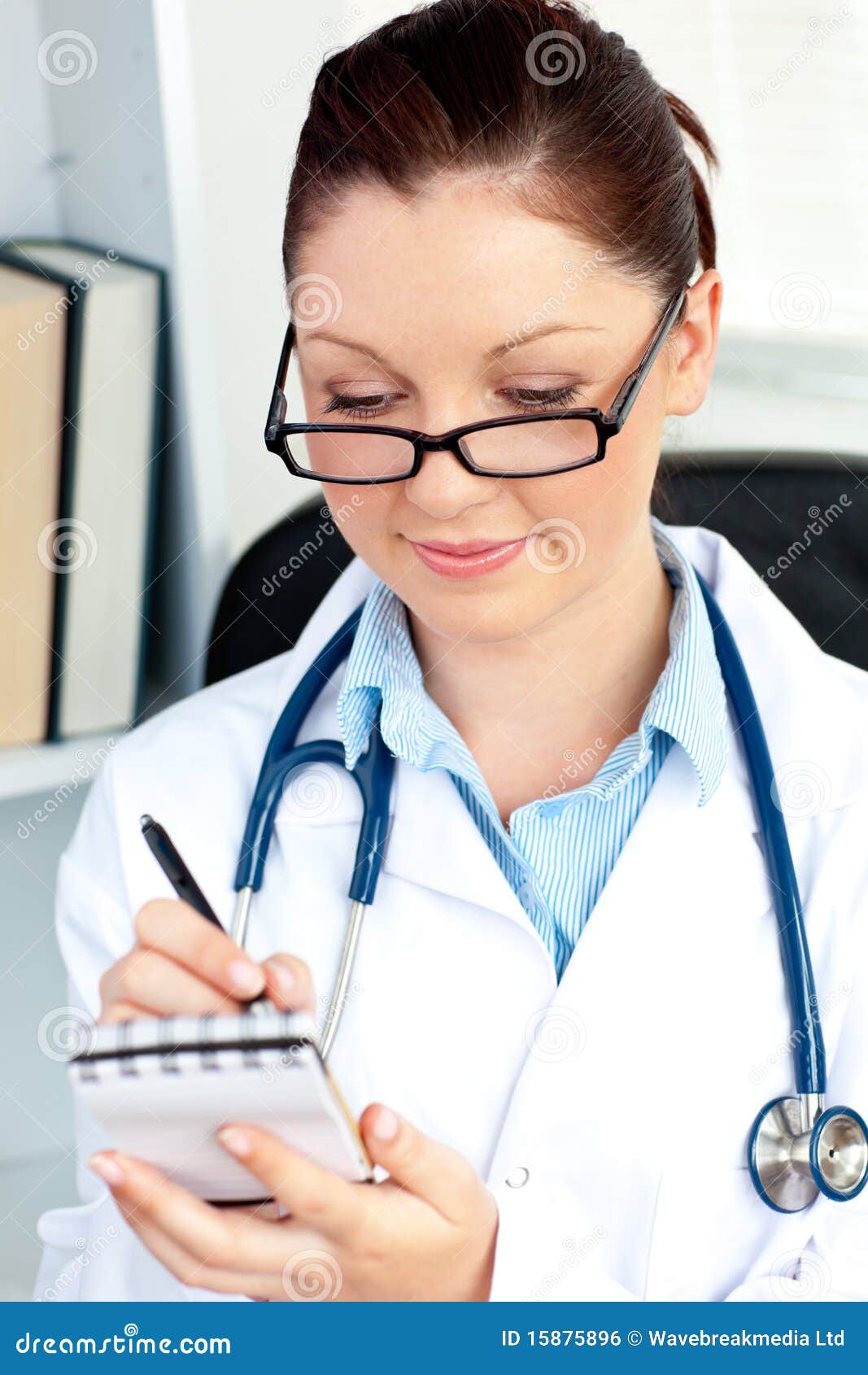 Serious Female Doctor Holding a Notepad Stock Photo - Image of office ...