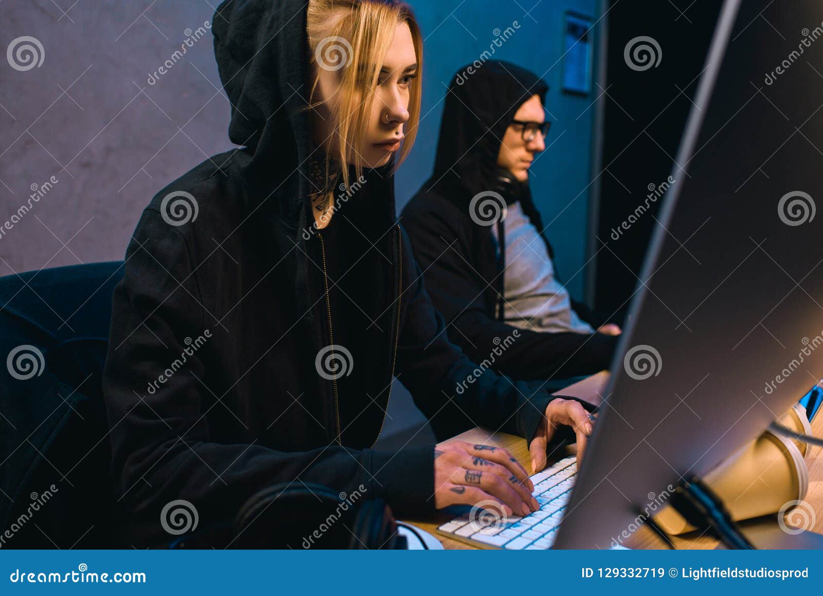 Serious Female Hacker Working on New Malware with Accomplice Stock ...