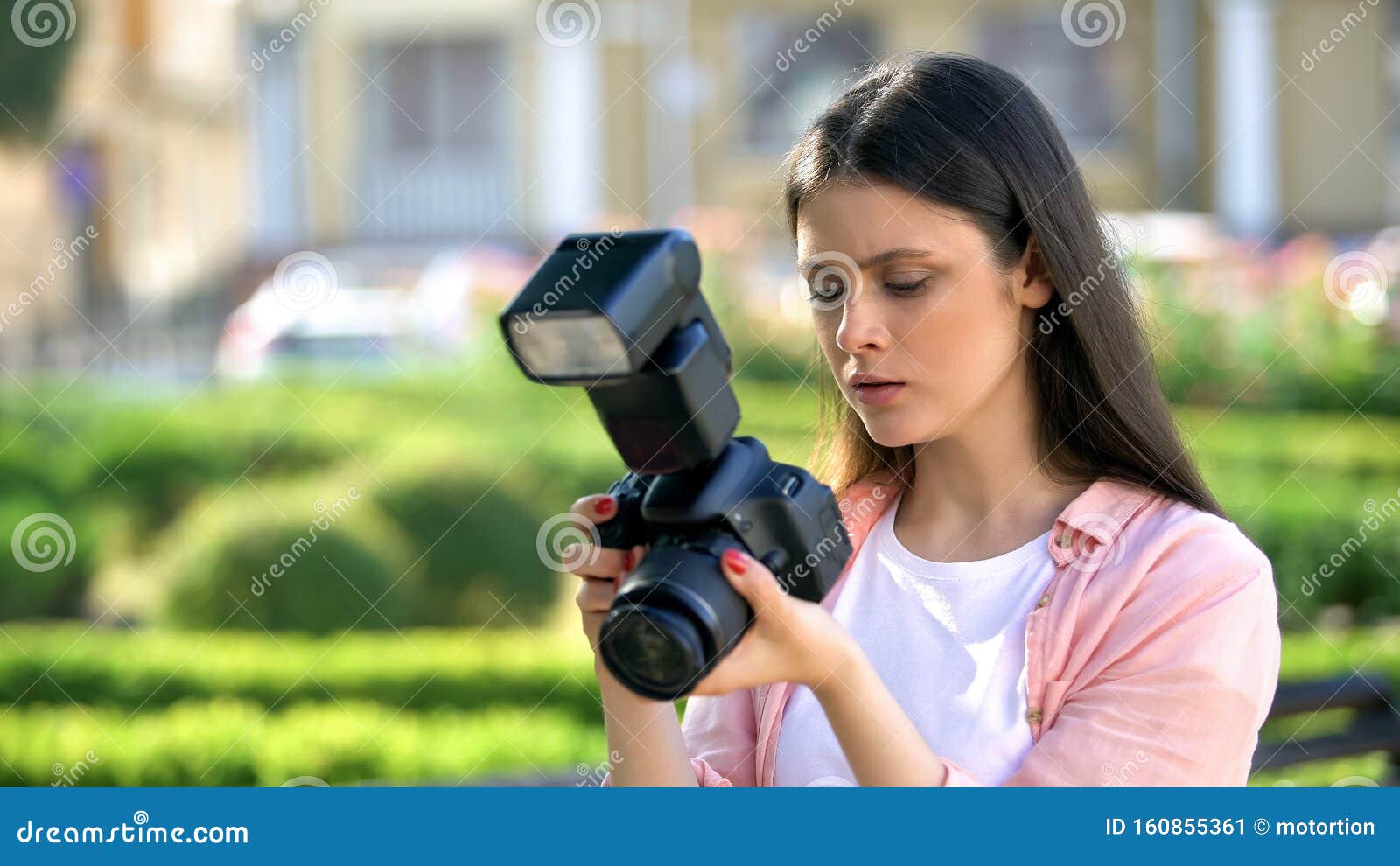 Serious Female Photographer Checking Settings on Camera, Technique ...