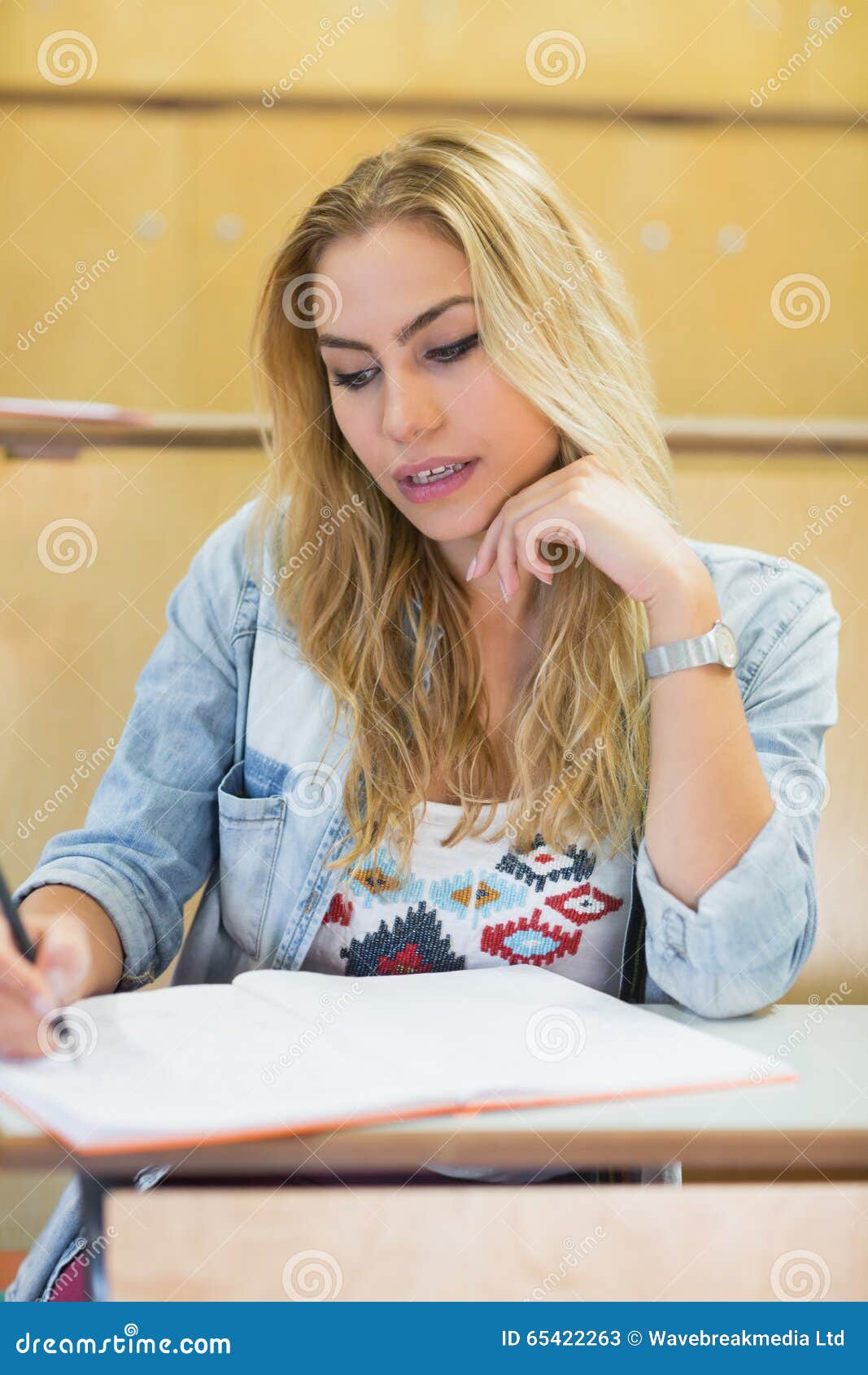 Serious Female Student Writing during Class Stock Image - Image of ...