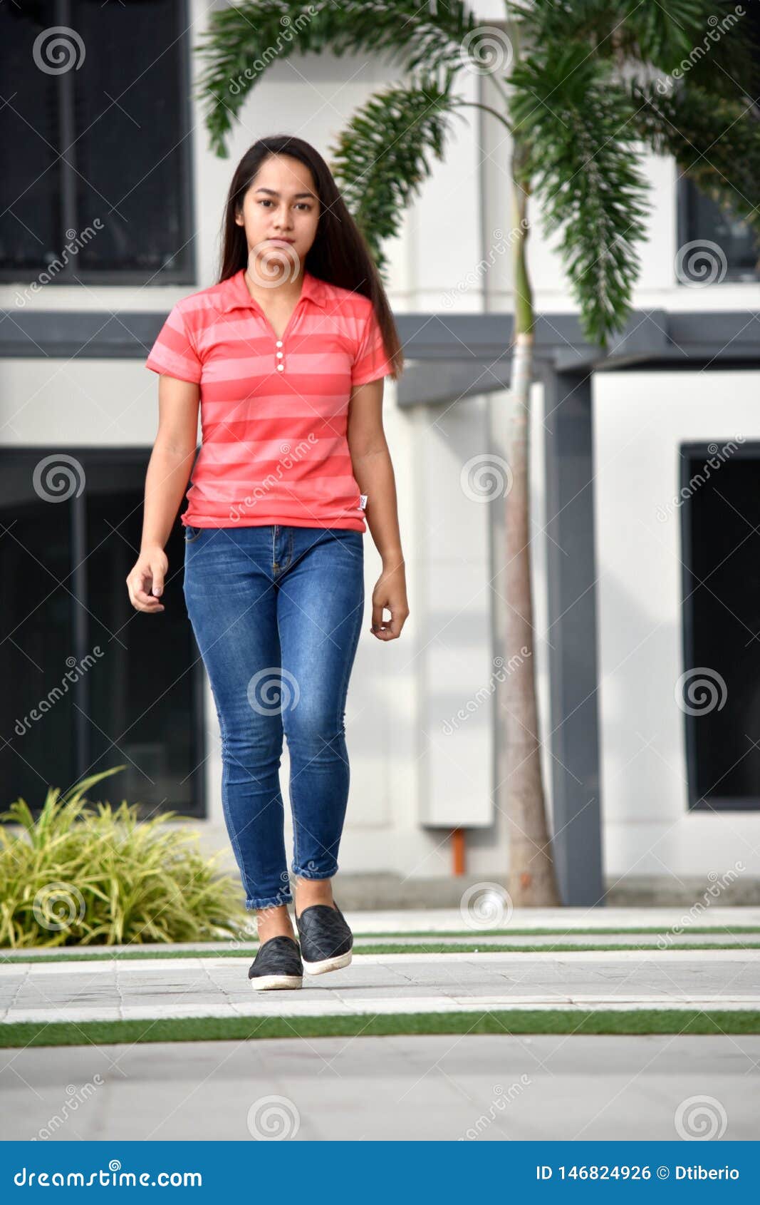 Serious Filipina Person Walking Stock Photo - Image of walk, commuter ...