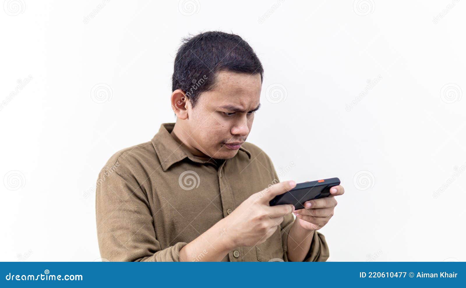 Serious And Focus Face Expression Of Young Asian Malay Man Looking At