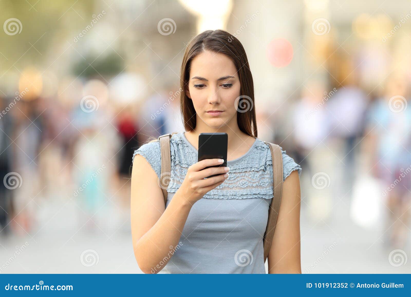 Serious Girl Checking Phone Message on the Street Stock Photo - Image ...