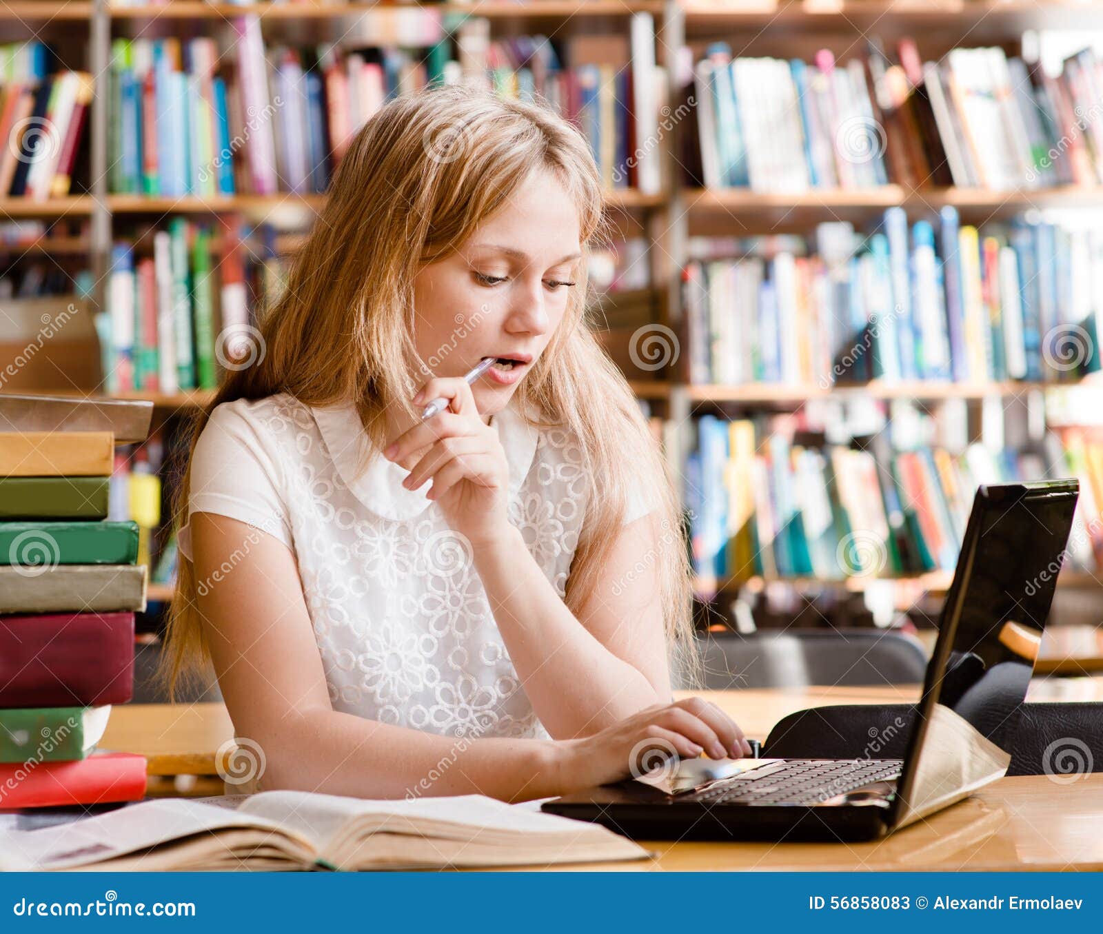 Serious Girl Typing on Notebook in Library Stock Image - Image of ...