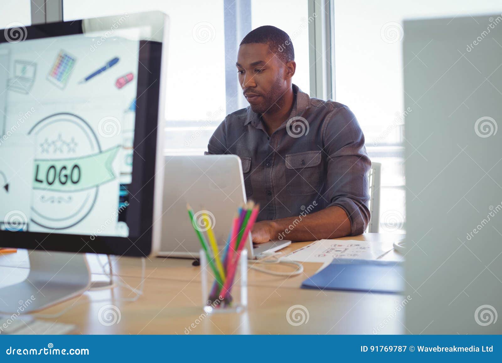 Serious Graphic Designer Using Laptop in Creative Office Stock Image ...