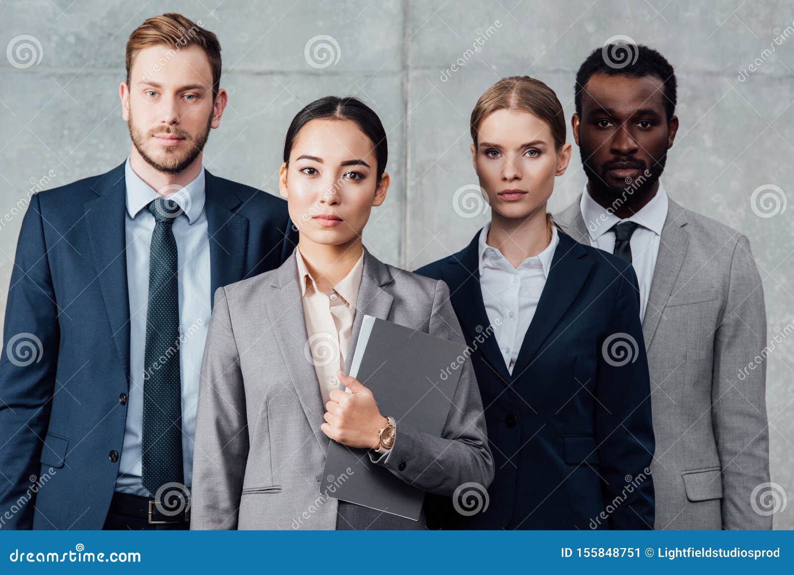 Serious Group of Multiethnic Businesspeople in Formal Wear Looking ...