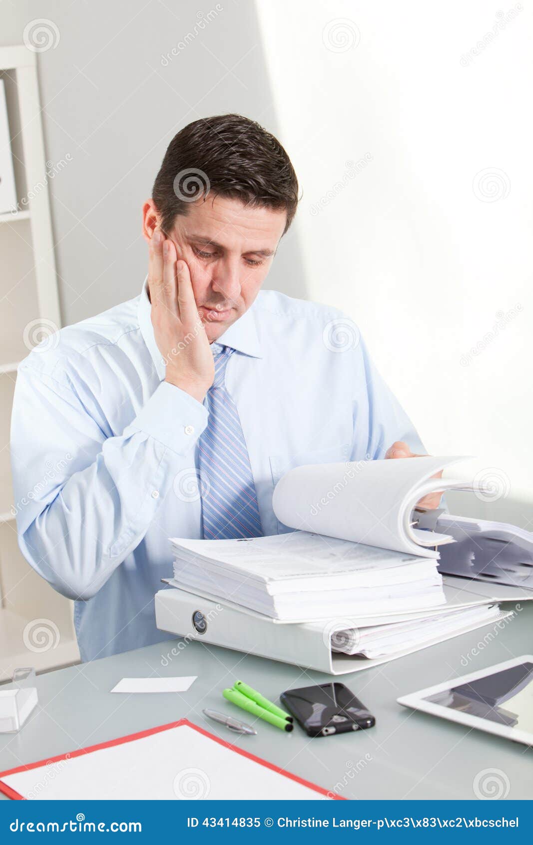 Serious Handsome Employee Reading Manuals Stock Image - Image of ...