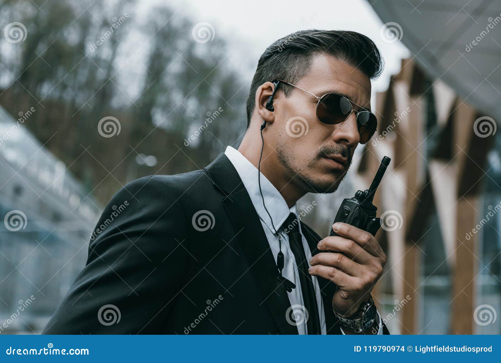 Serious Handsome Security Guard Talking Stock Photo - Image of male ...