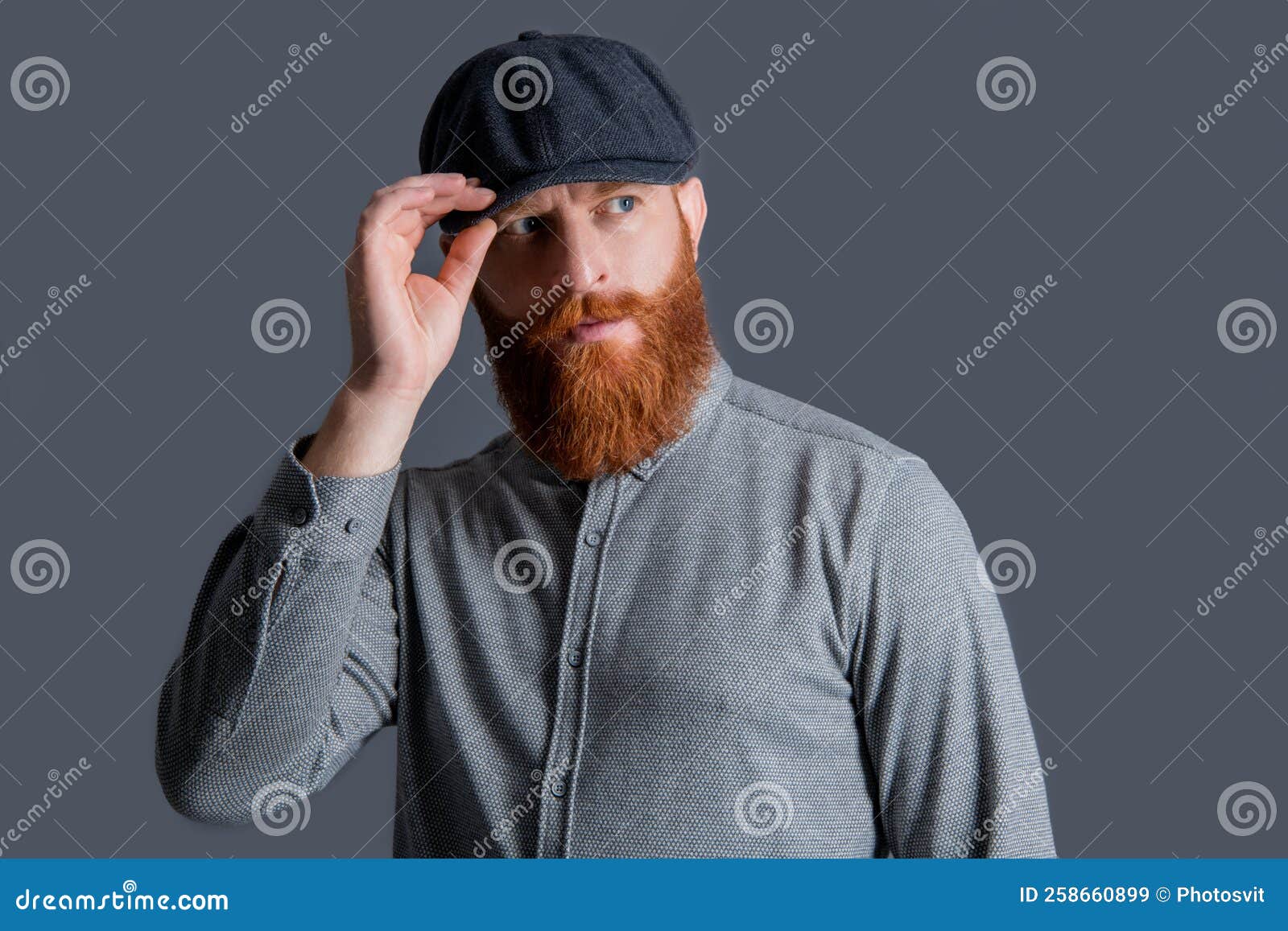 Serious Irish Guy Adjusting Cap. Portrait of Bearded Guy Stock Image ...