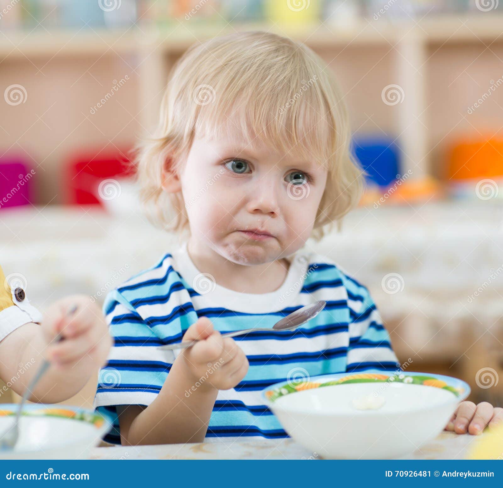 Serious Kid Eating from Plates in Kindergarten Stock Image - Image of ...