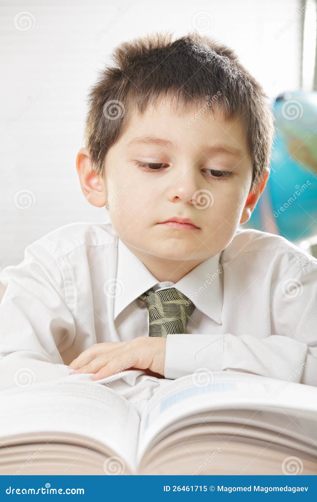 Serious kid reading book stock image. Image of formal - 26461715
