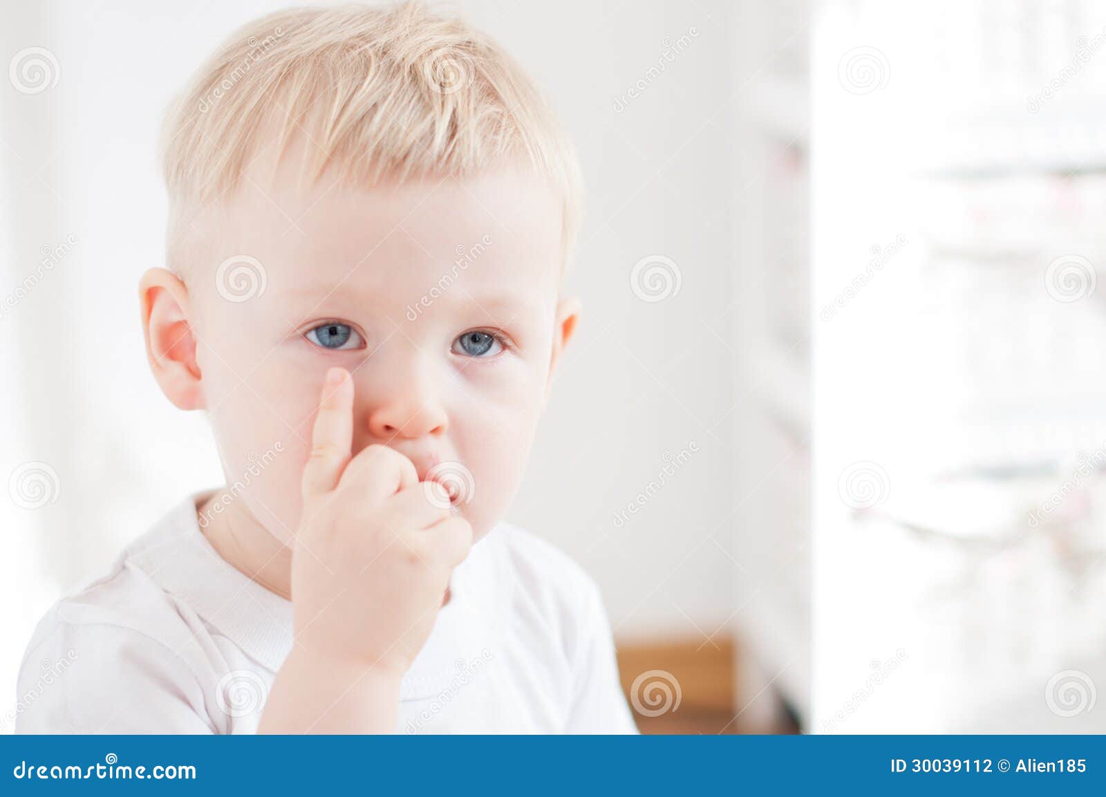Serious kid is thinking stock photo. Image of hand, indoor - 30039112