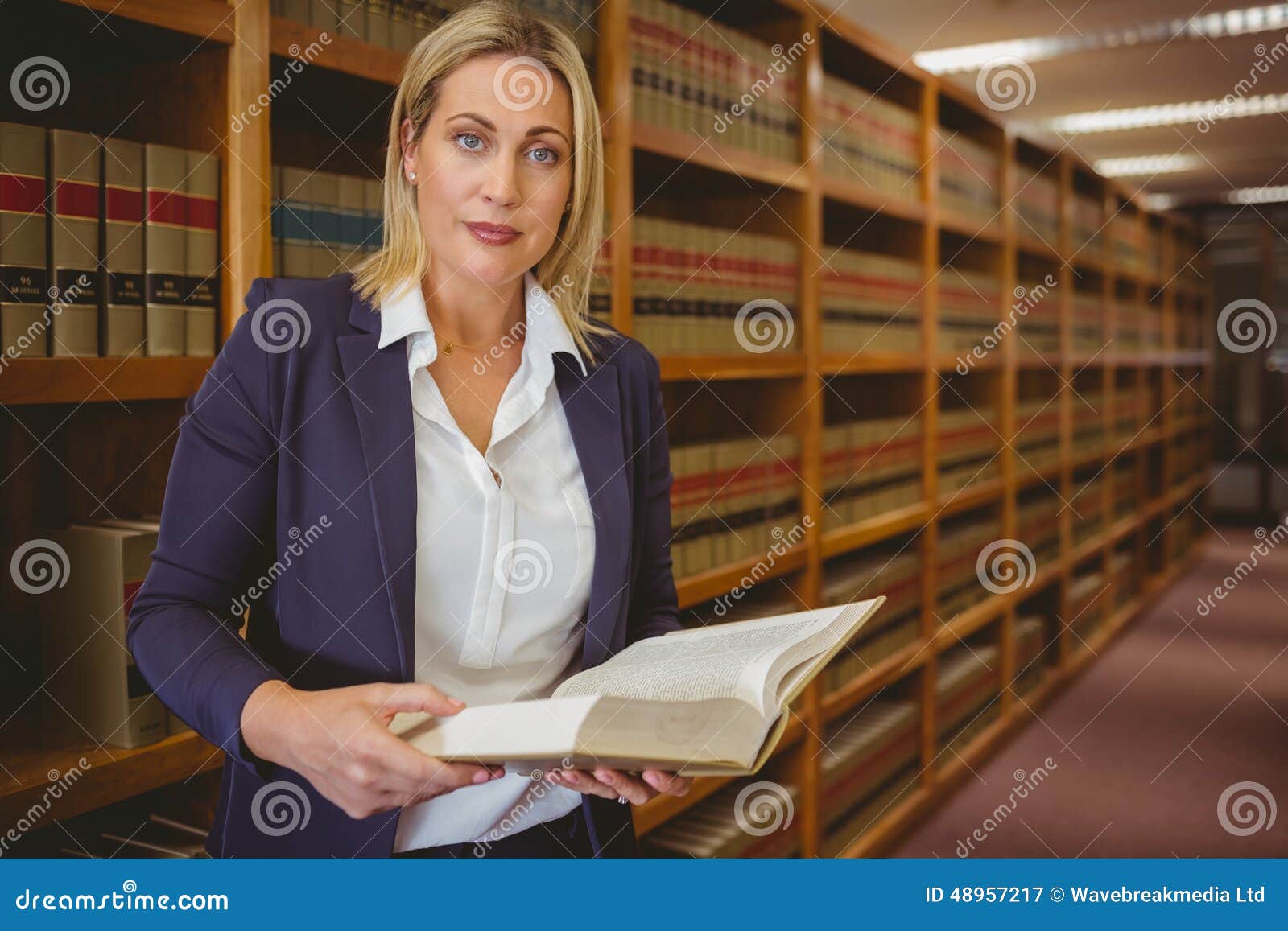 Serious Librarian Reading a Book Stock Image - Image of female, side ...