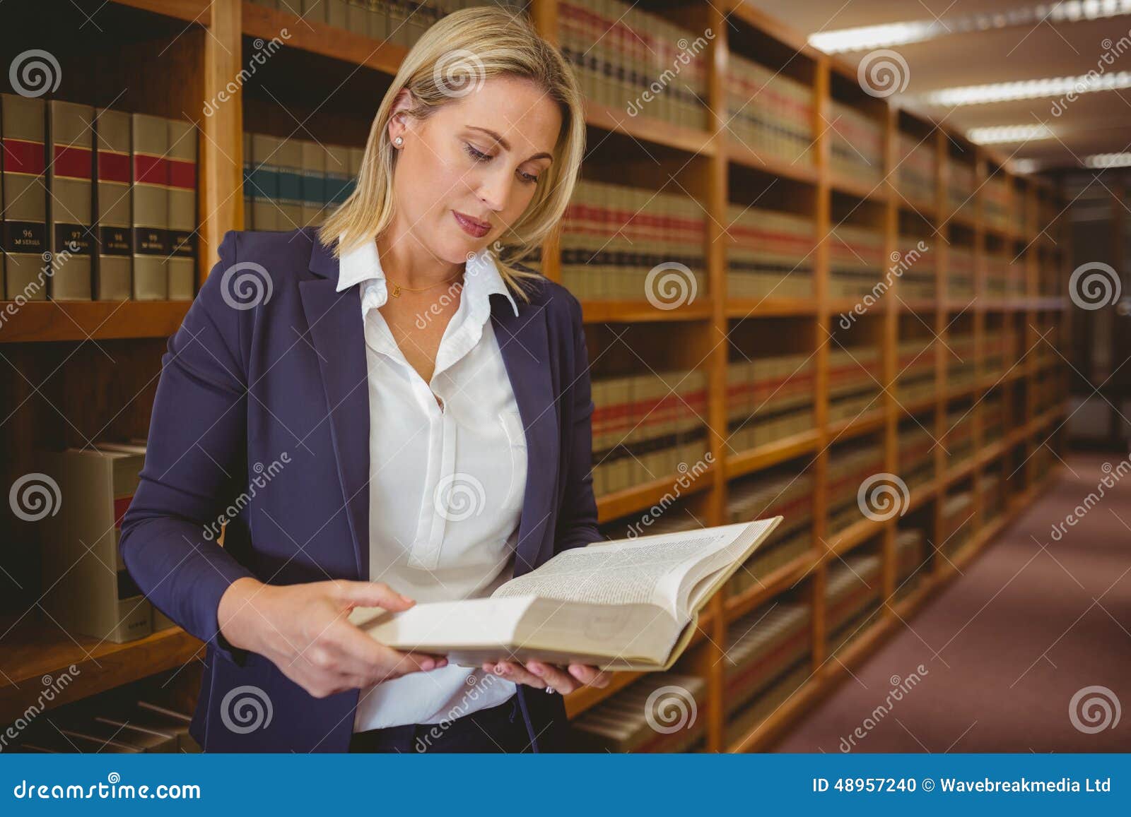 Serious Librarian Reading a Book Stock Photo - Image of library, side ...