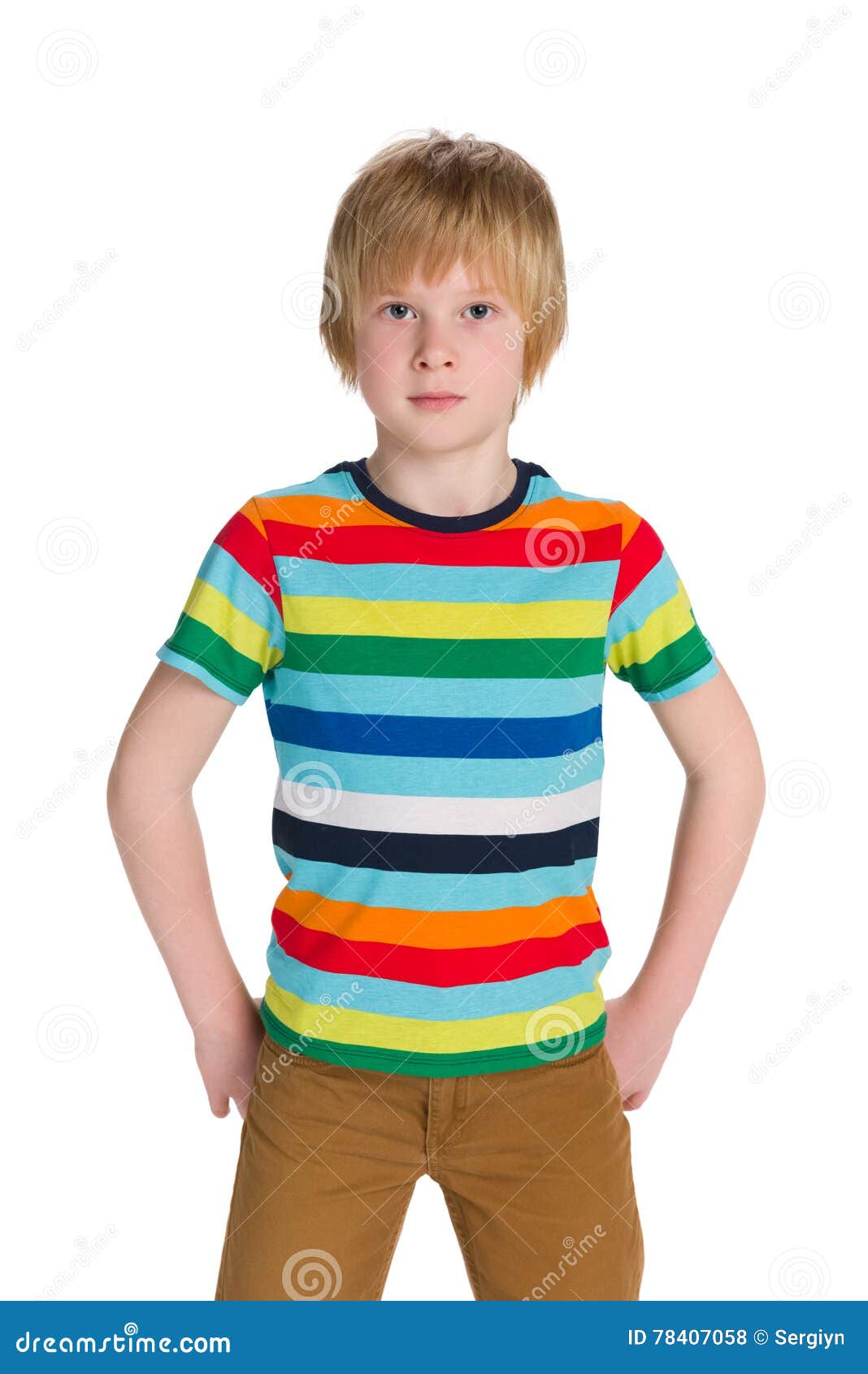 Serious little boy stands stock photo. Image of studio - 78407058