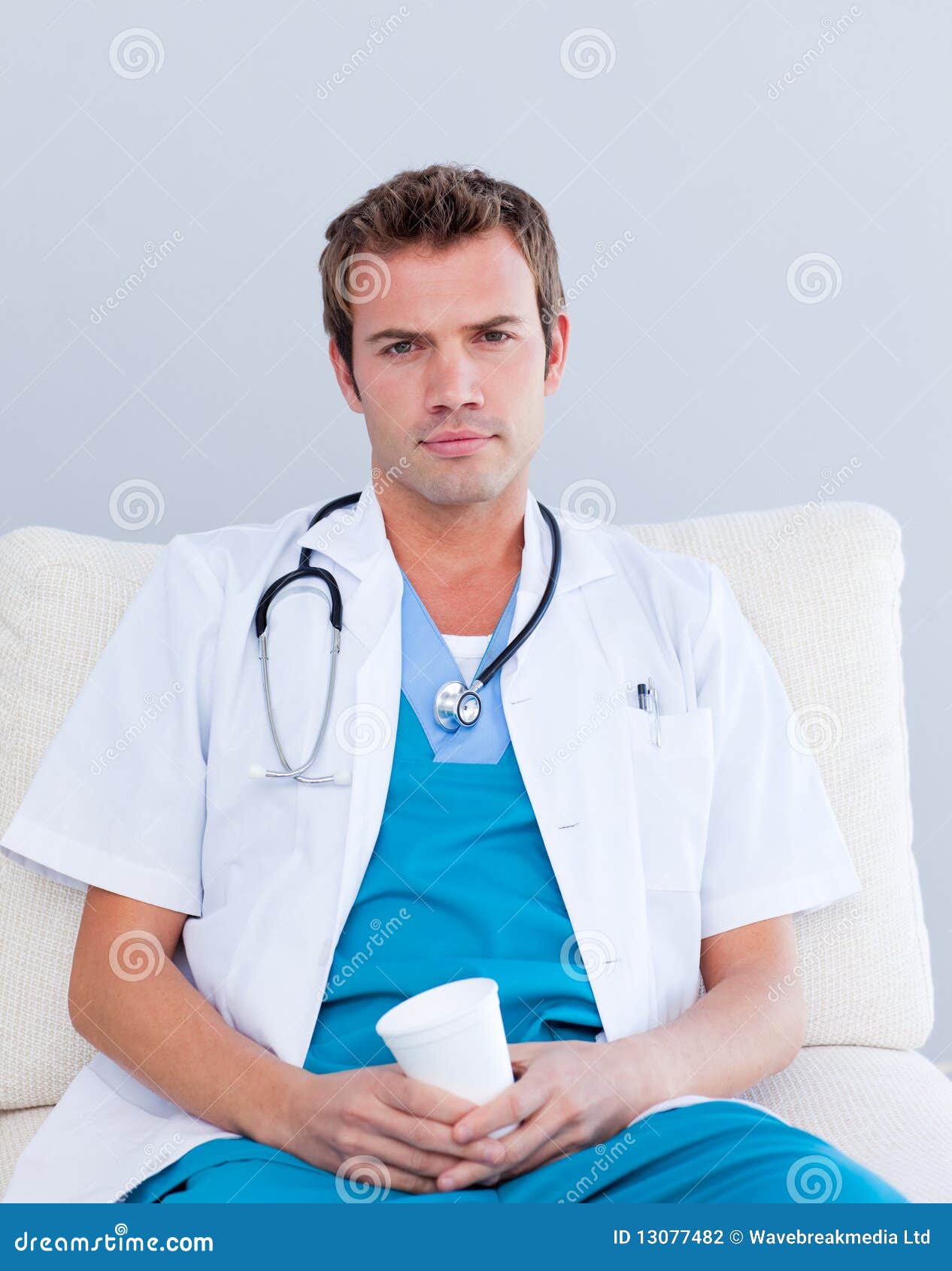 Serious Male Doctor Drinking Coffee Stock Photo - Image of doctor ...