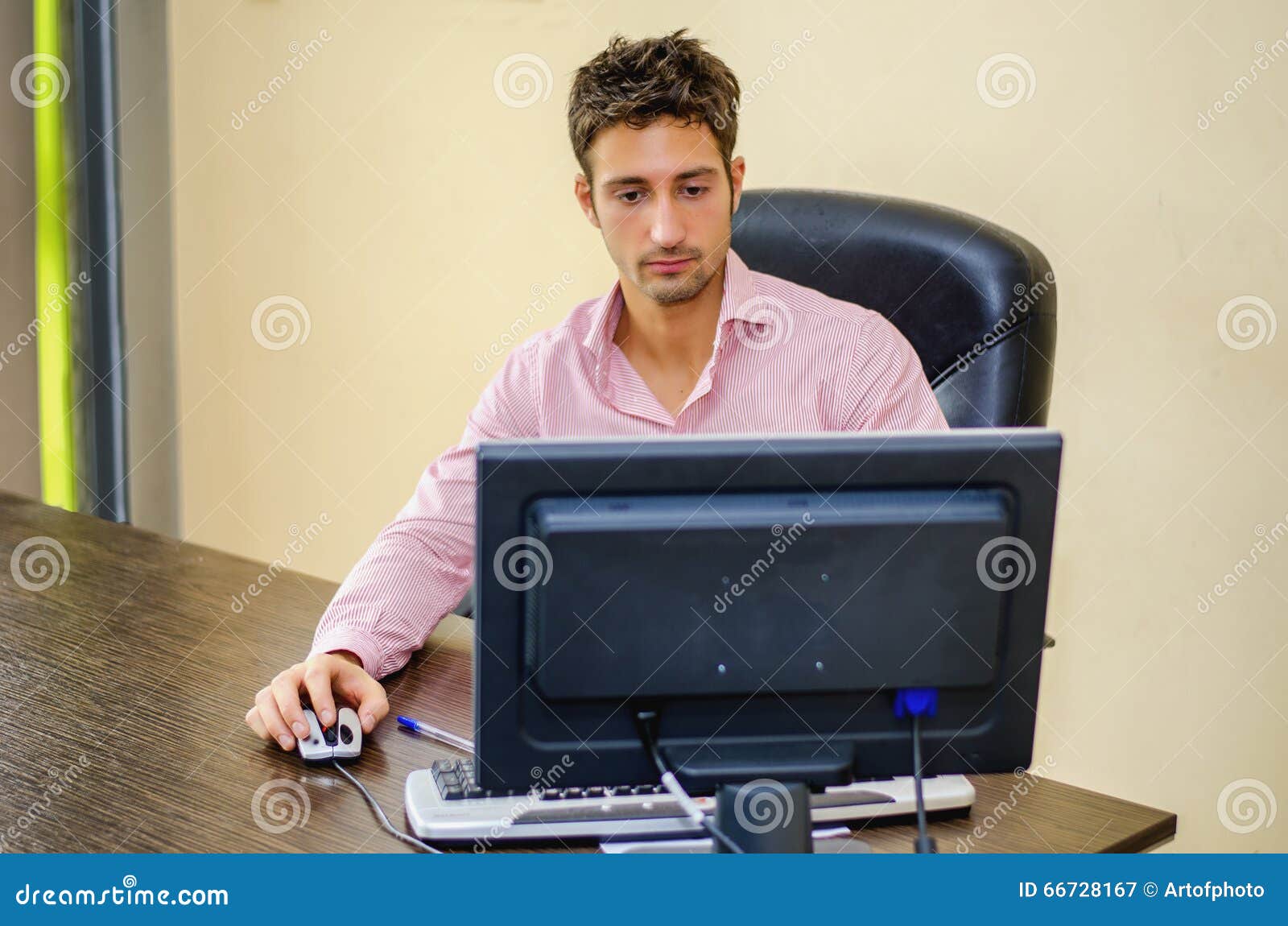 Serious Male Office Worker at Desk Working Stock Image - Image of ...