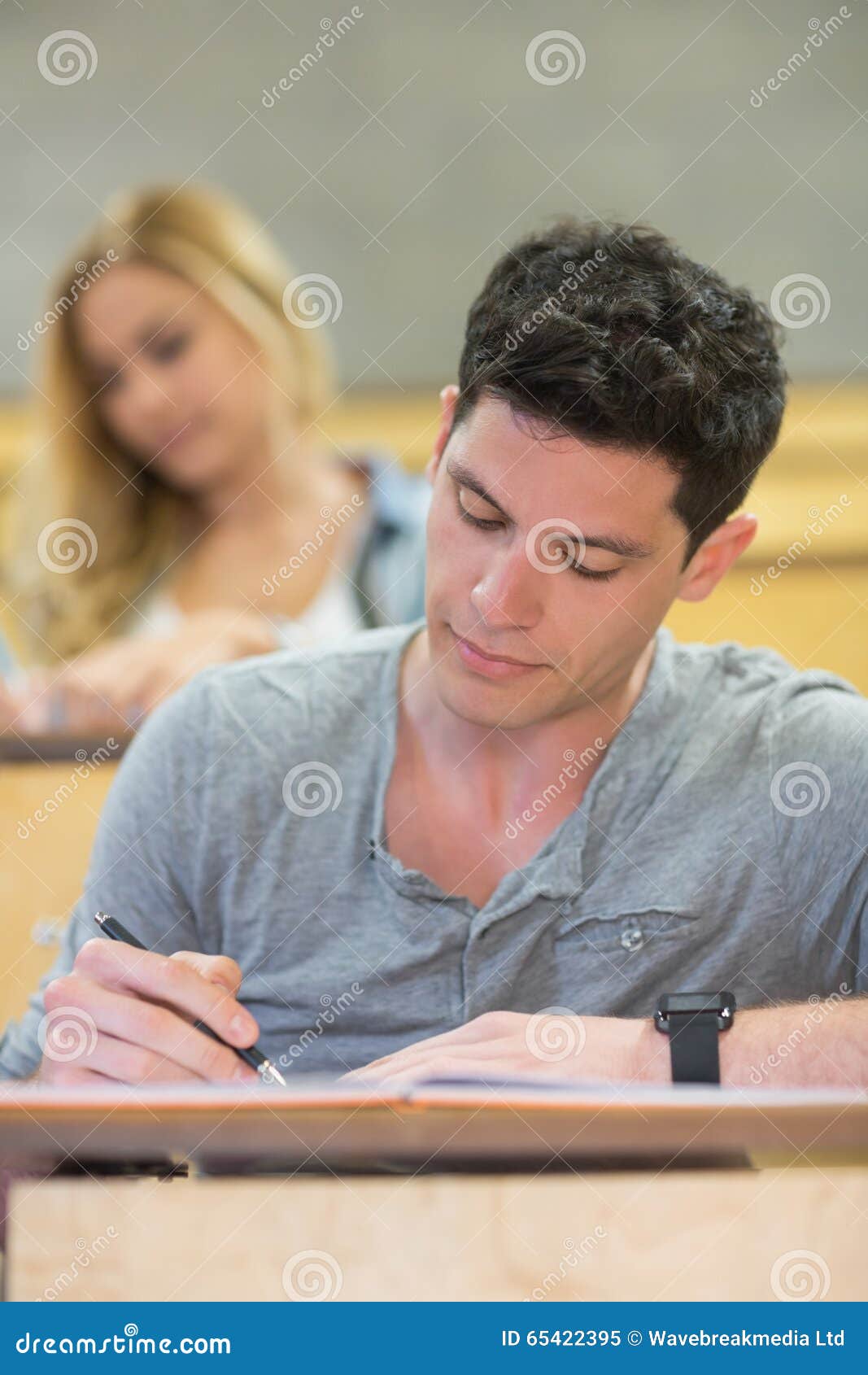 Serious Male Student during Class Stock Image - Image of sitting ...