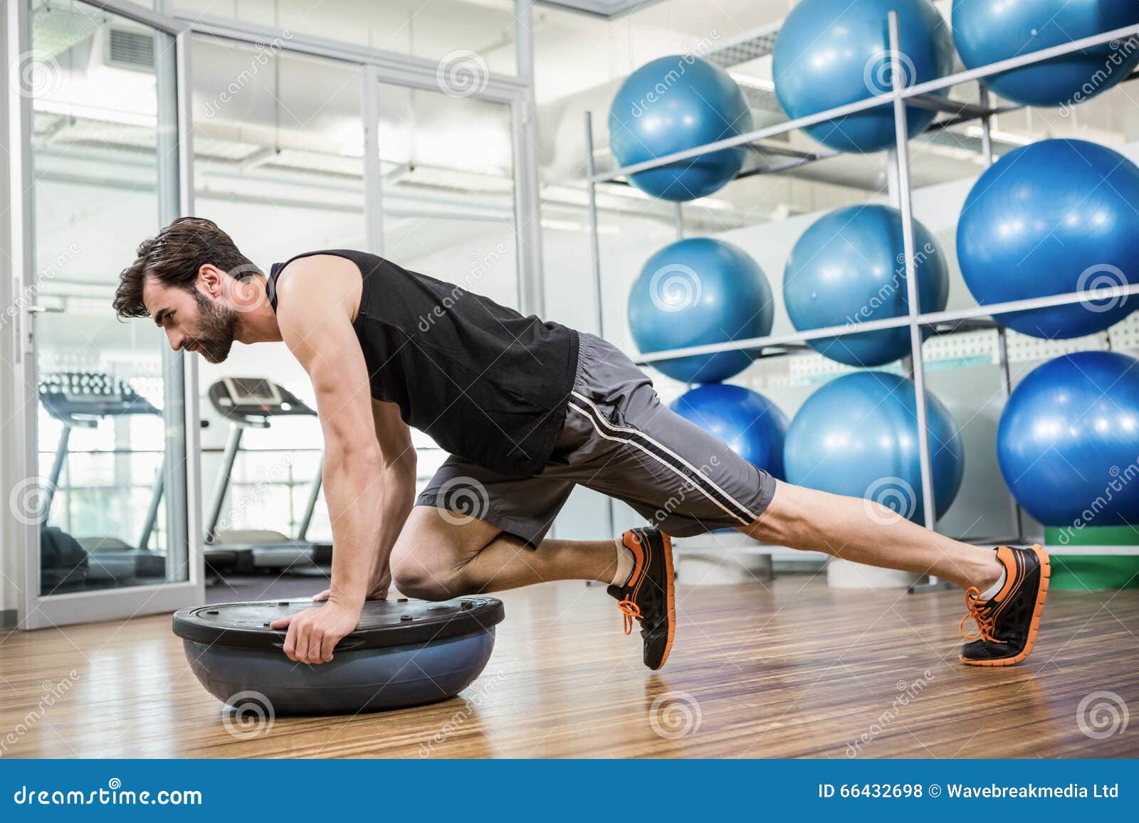 Serious Man Doing Exercise with Bosu Ball Stock Photo - Image of sport ...