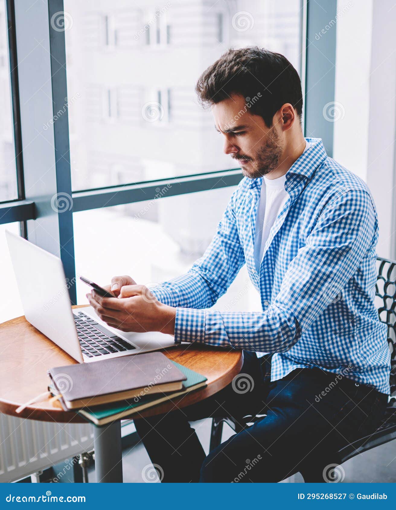 Concentrated Male Freelancer Sharing Information Via Smartphone and ...