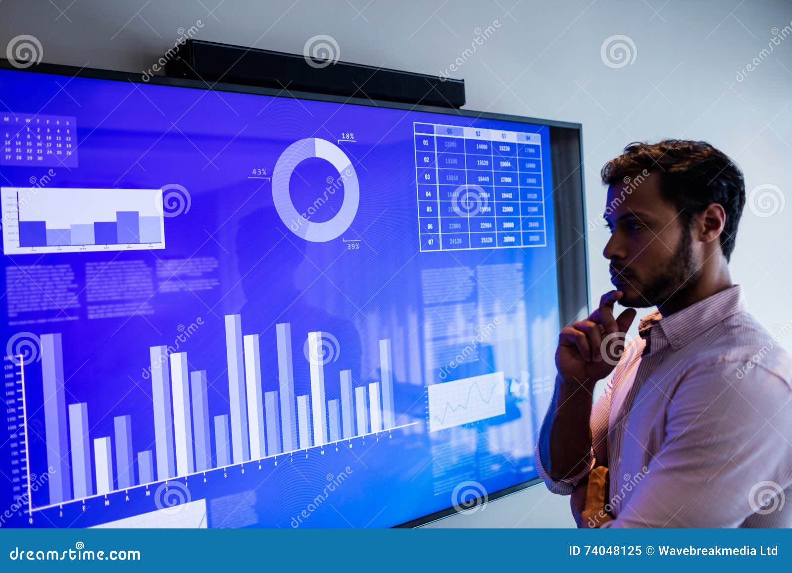 Serious Man Looking at Graph on a Screen Stock Image - Image of serious ...