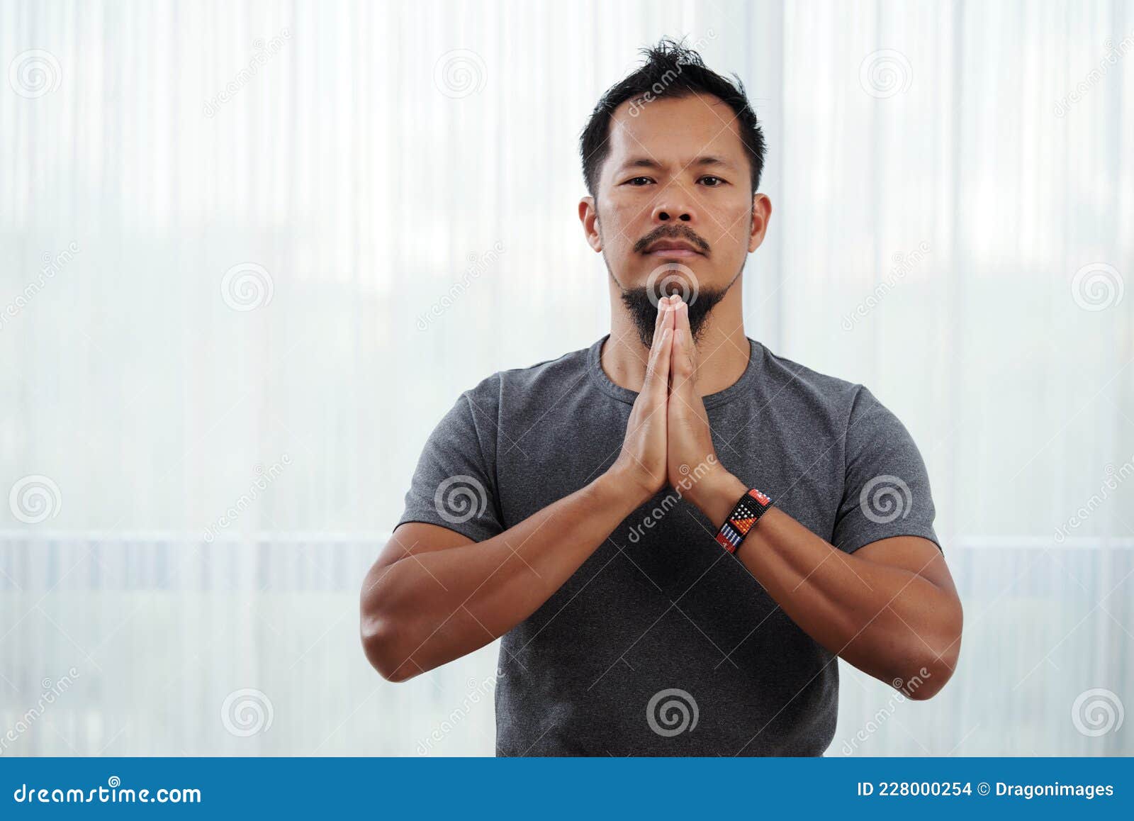 Serious Man Making Namaste Gesture Stock Photo - Image of meditating ...