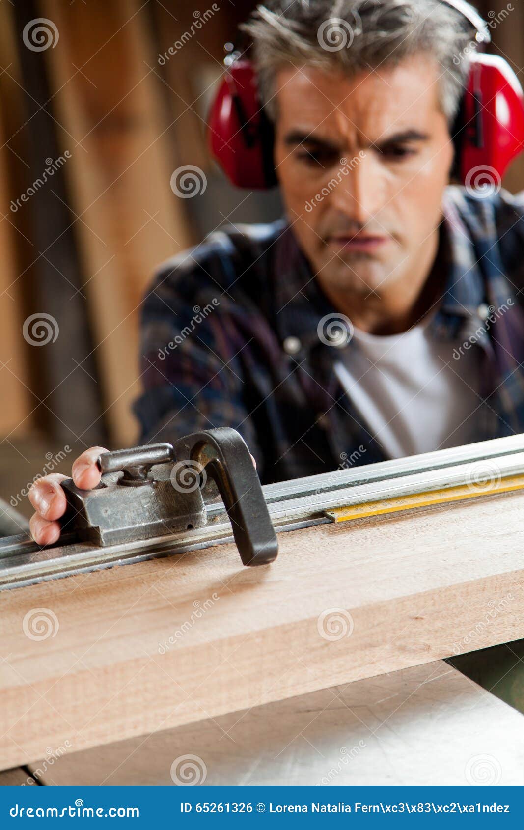 Serious Man Measuring a Piece of Wood Stock Photo - Image of occupation ...