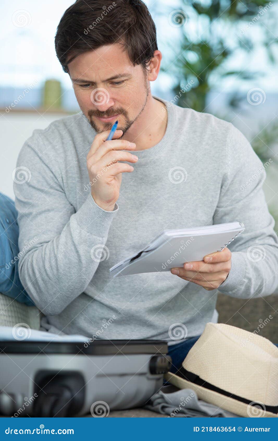 Serious Man Packing Clothes into Suitcase Preparing for Vacation Stock ...